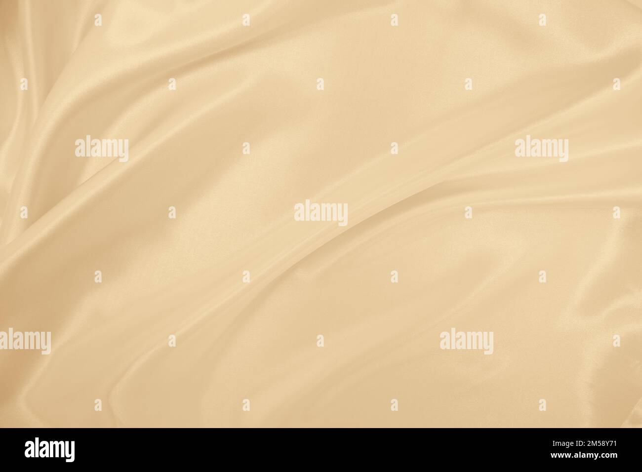Smooth elegant golden silk or satin luxury cloth texture can use as ...