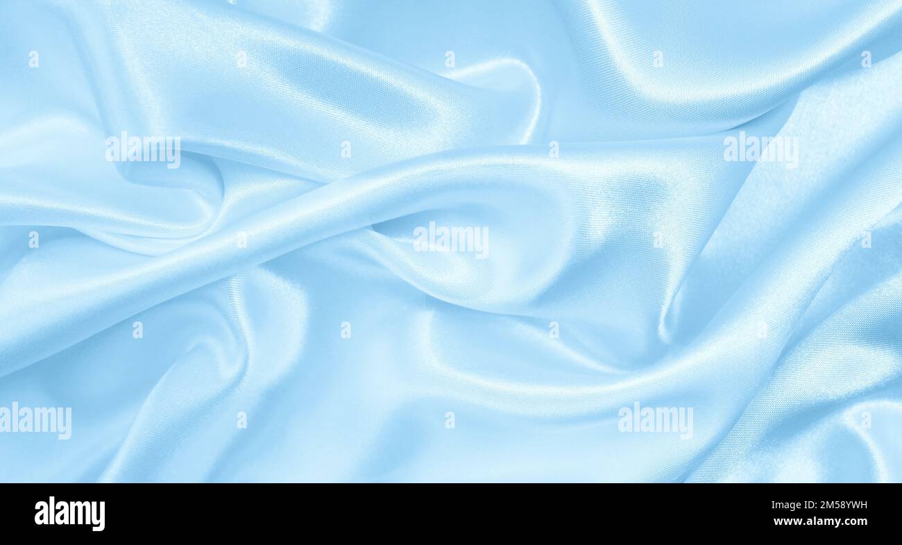 Smooth elegant blue silk or satin luxury cloth texture can use as ...