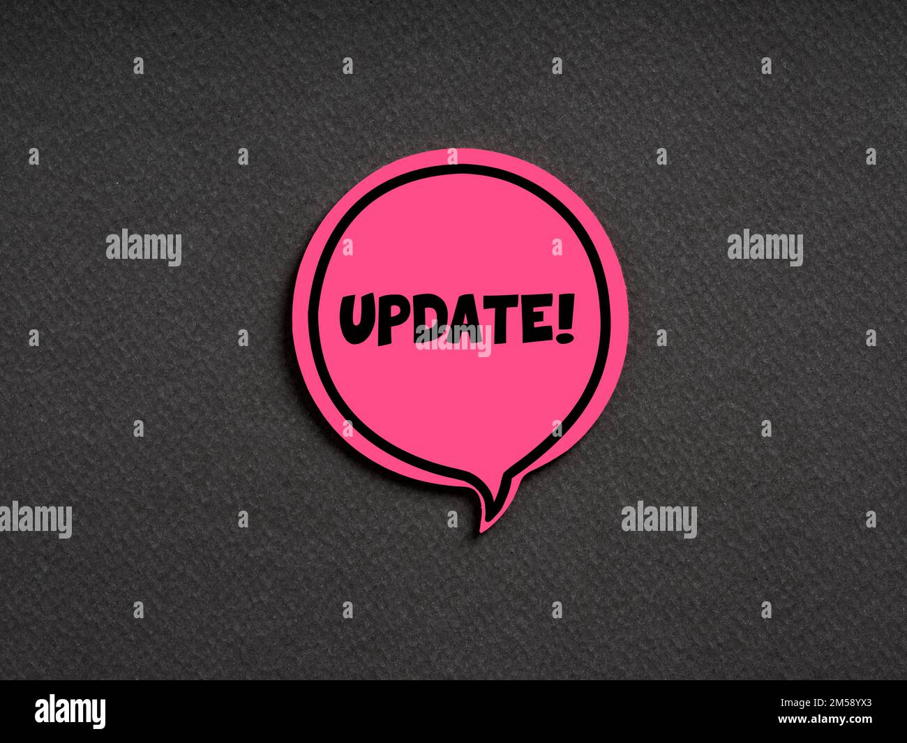 The word update on pink speech bubble on black background. Technology ...
