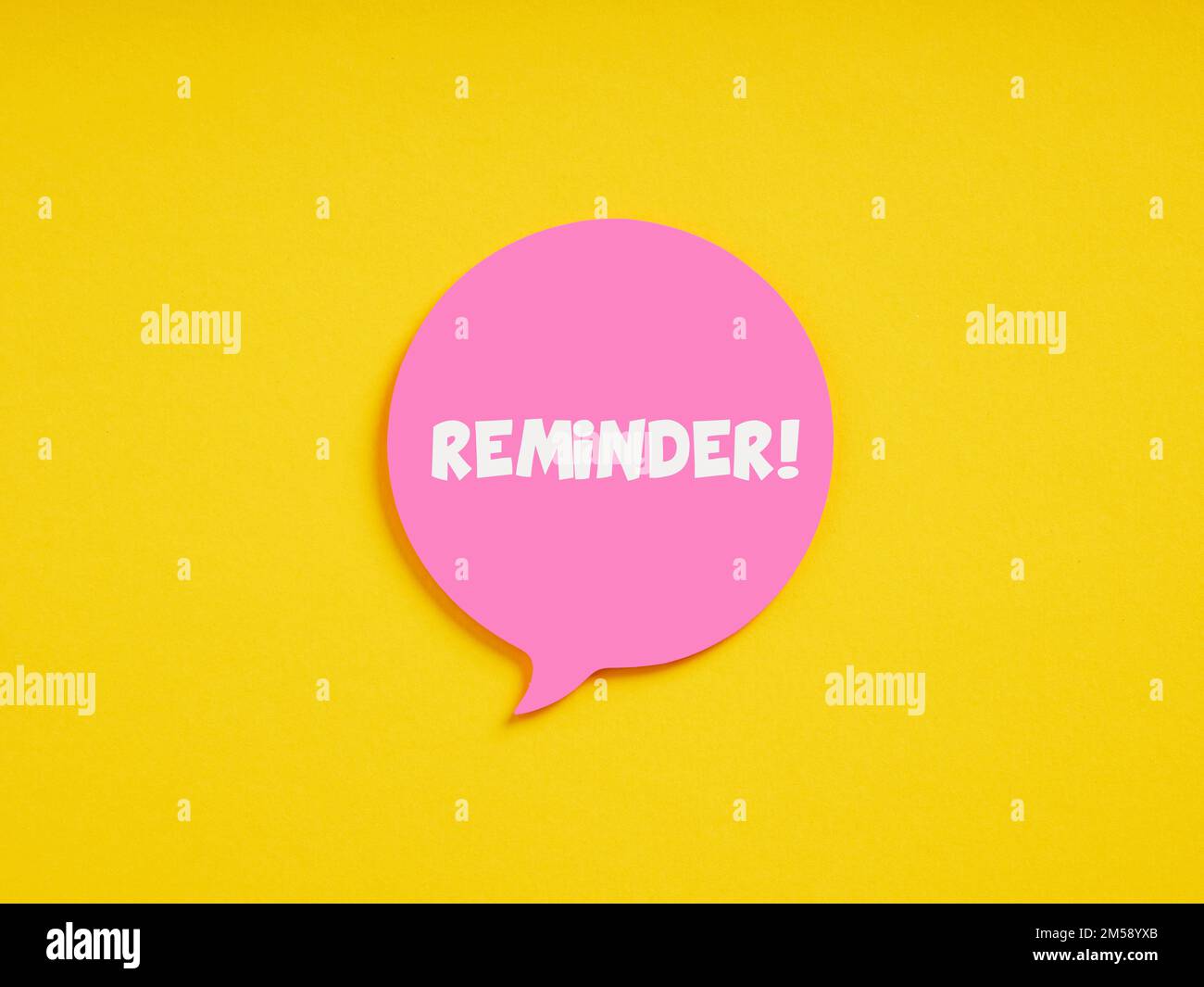 The word reminder on pink speech bubble on yellow background. Important ...