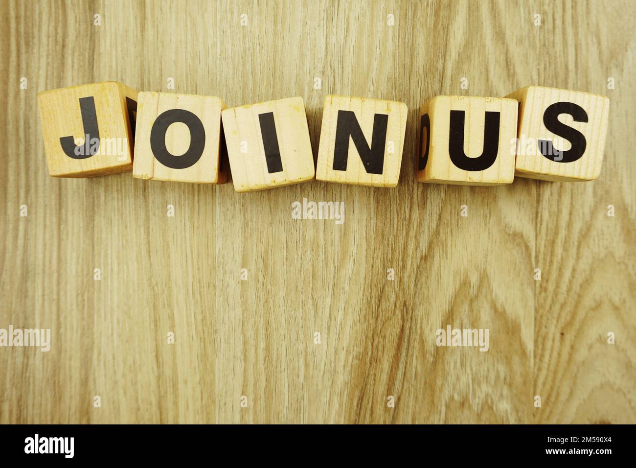 join us alphabet top view on wooden background Stock Photo - Alamy