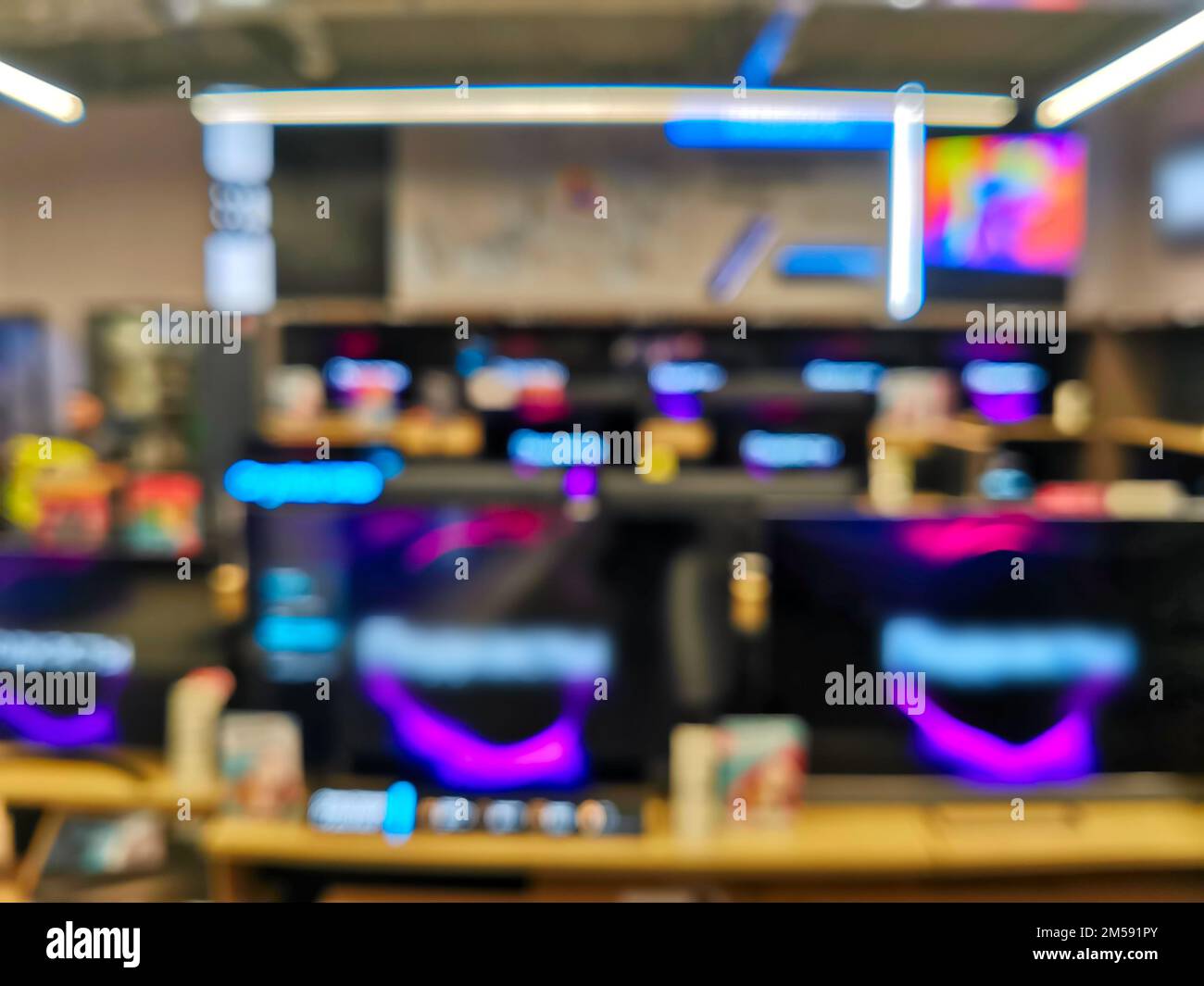 Showcase with TV sets in the modern electronics store. Buy a TV. Many ...