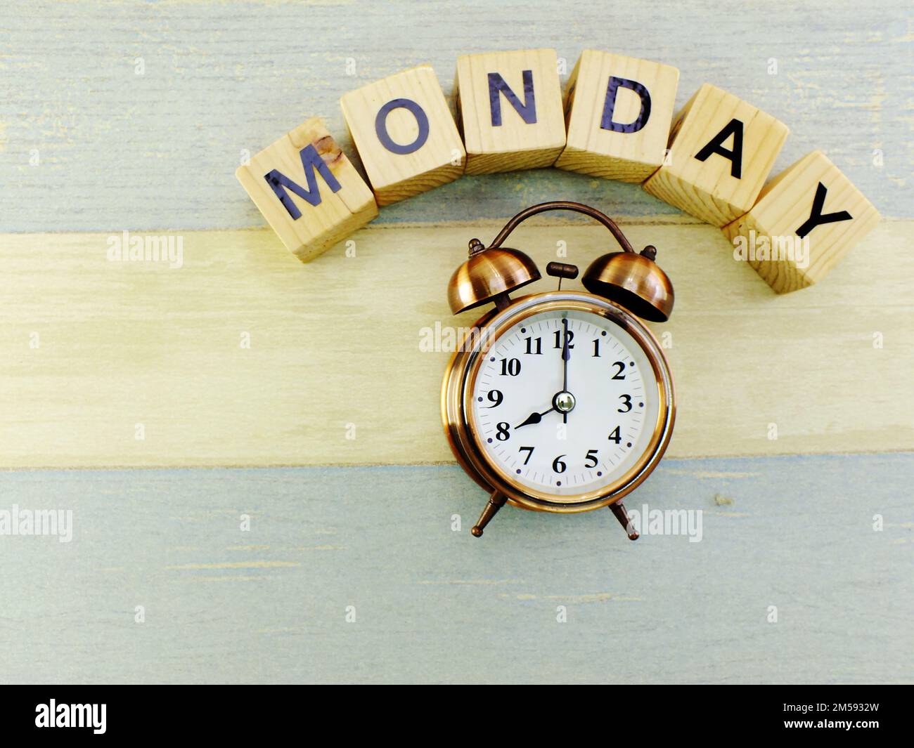 monday cube wooden block and alarm clock top view with space background ...