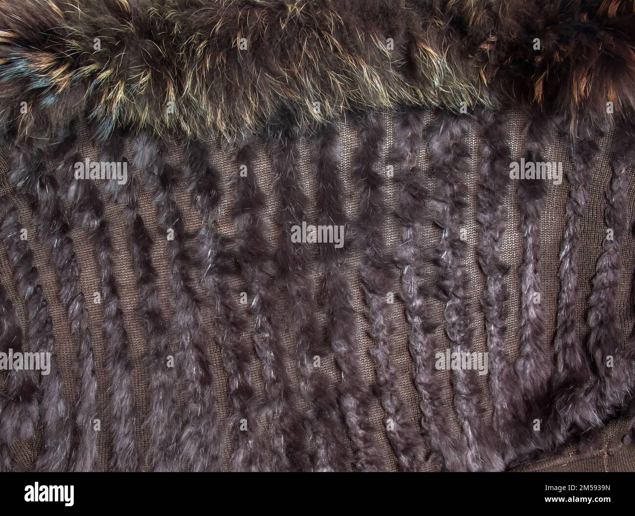 Background from dark brown fur and wool. Combined knitted fur product ...