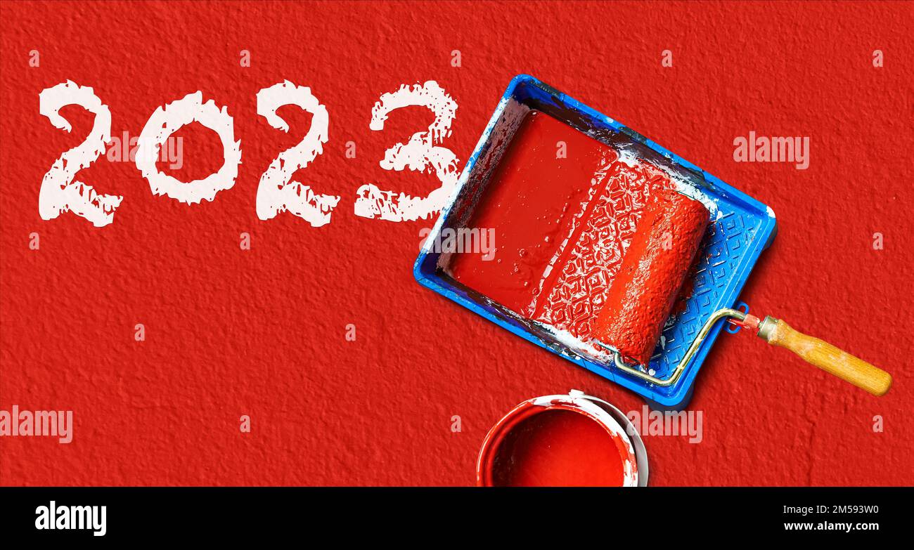 Painting tools and 2023 text on red wall. Happy New Year Stock Photo ...