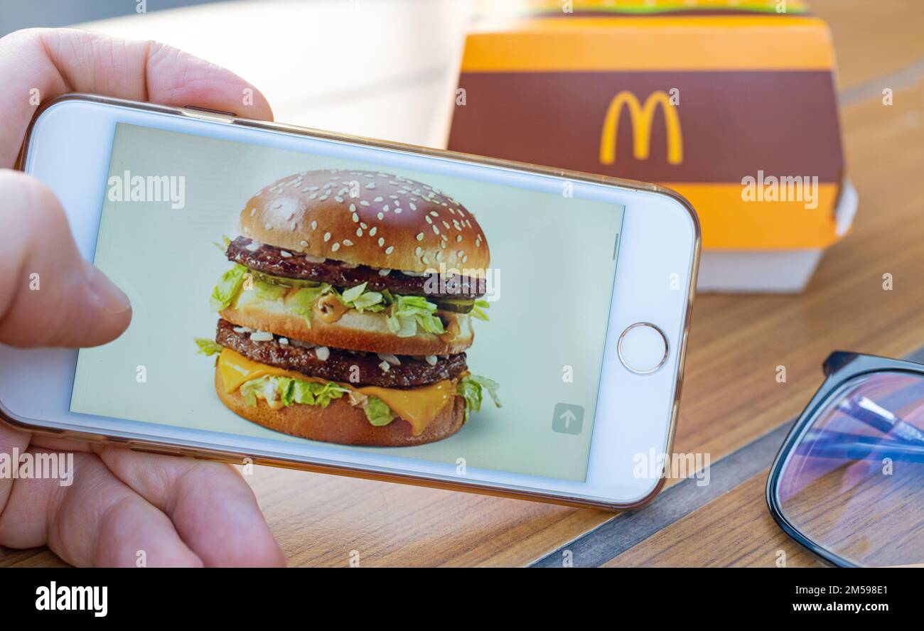A man looks at the McDonald's website for information about a burger ...
