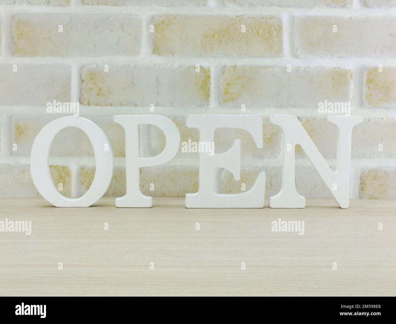 open wooden letter alphabet on wooden background Stock Photo - Alamy