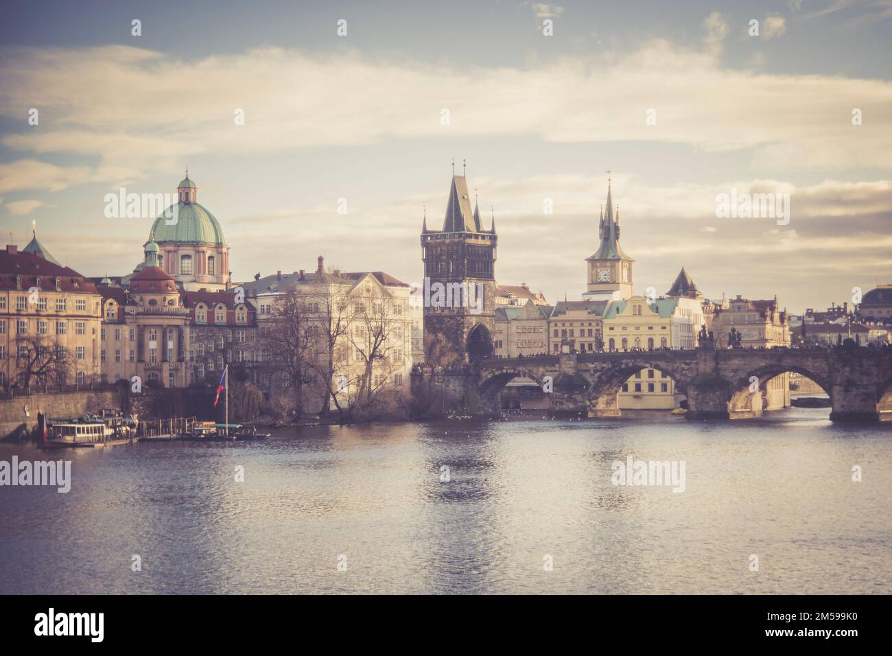 A scenic shot of the Charles Bridge with medieval architecture and a ...