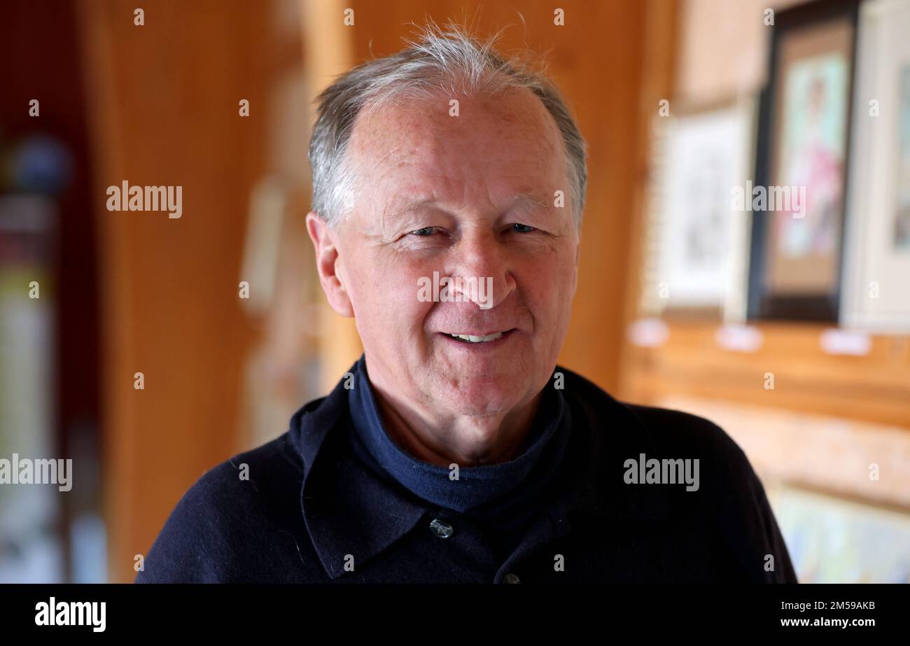 Wieck, Germany. 27th Dec, 2022. Christopher Walther, auctioneer, stands ...
