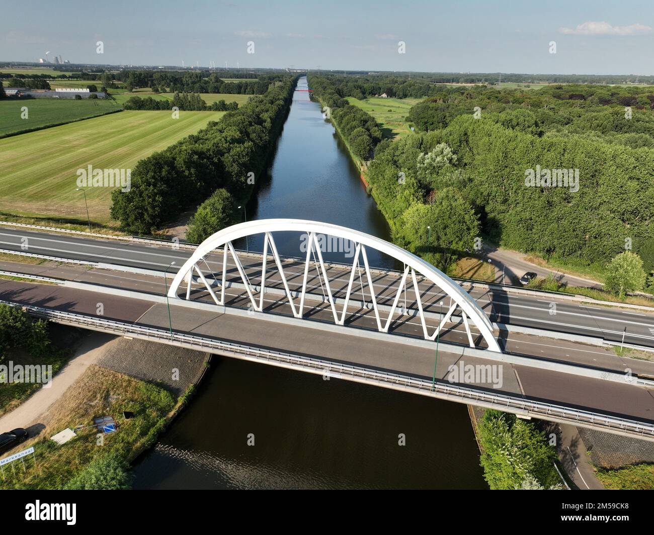 A bird's-eye view of an arch bridge over a river Stock Photo - Alamy