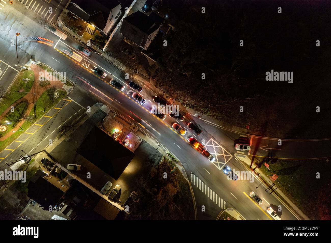 An aerial view of illuminated roads at night, with a long exposure shot ...