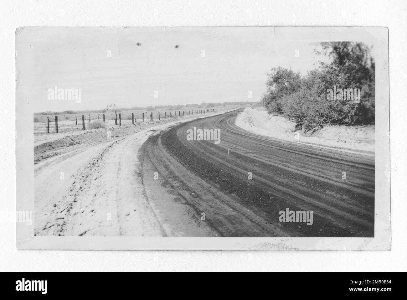 Original caption: "Torres-Martinez Res. - Curve in oiled road. Sta. 16 ...