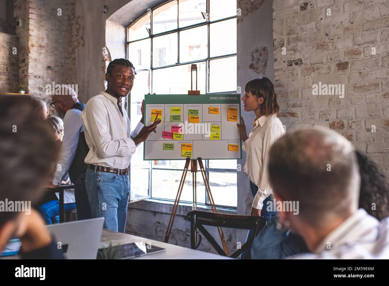 Mixed age range business people working in office, creatives and ...