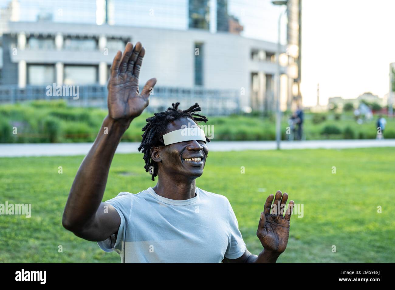 African adult ma wearing hi-tech goggles fo augmented reality ...