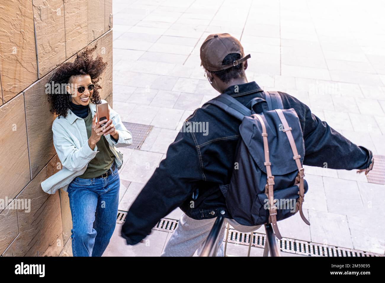 Generation z women having fun outdoor, young students and friends using ...