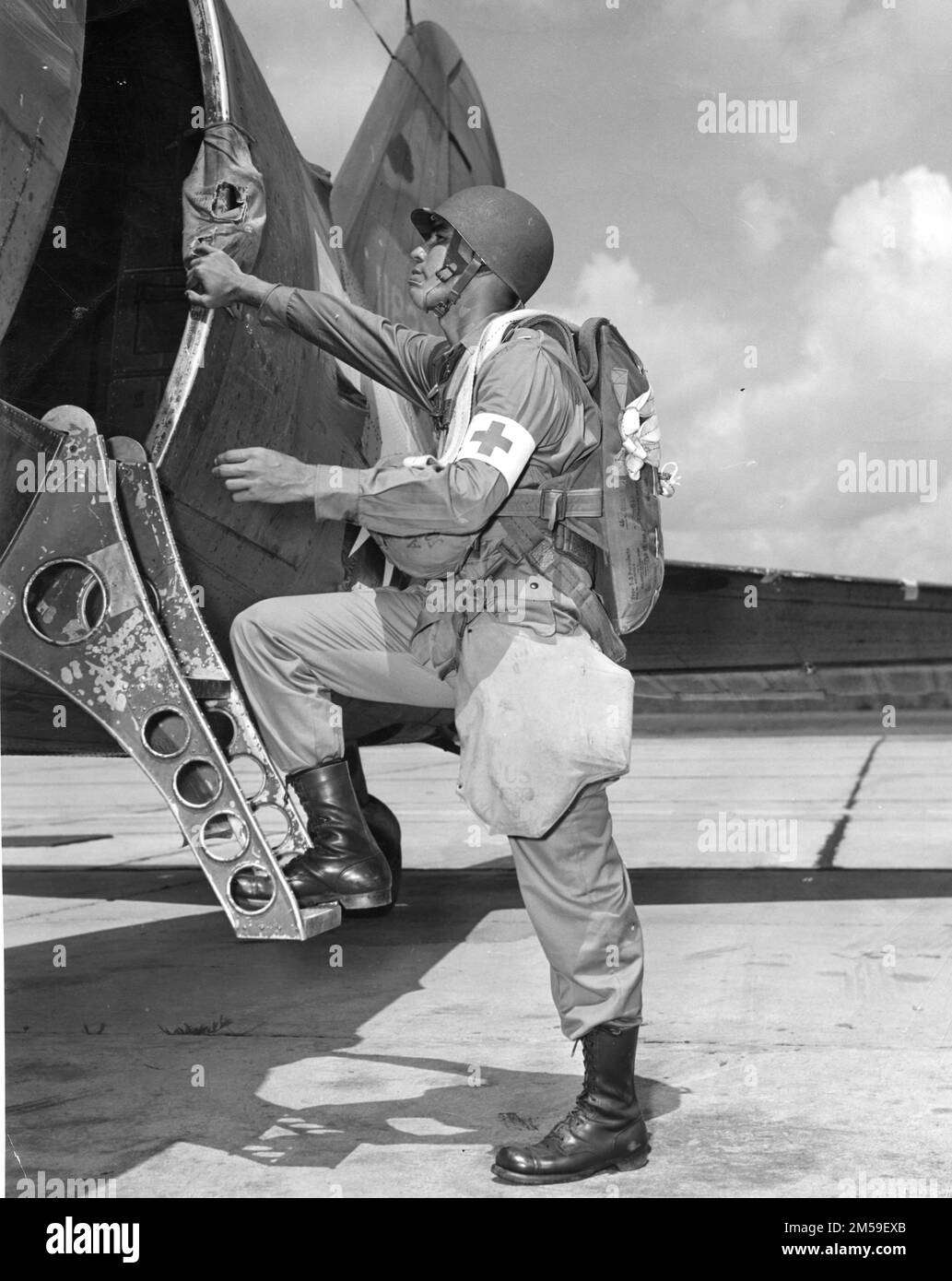 Photograph of Lt. Thomas Whitecloud Entering a C-47 for a Parachute ...