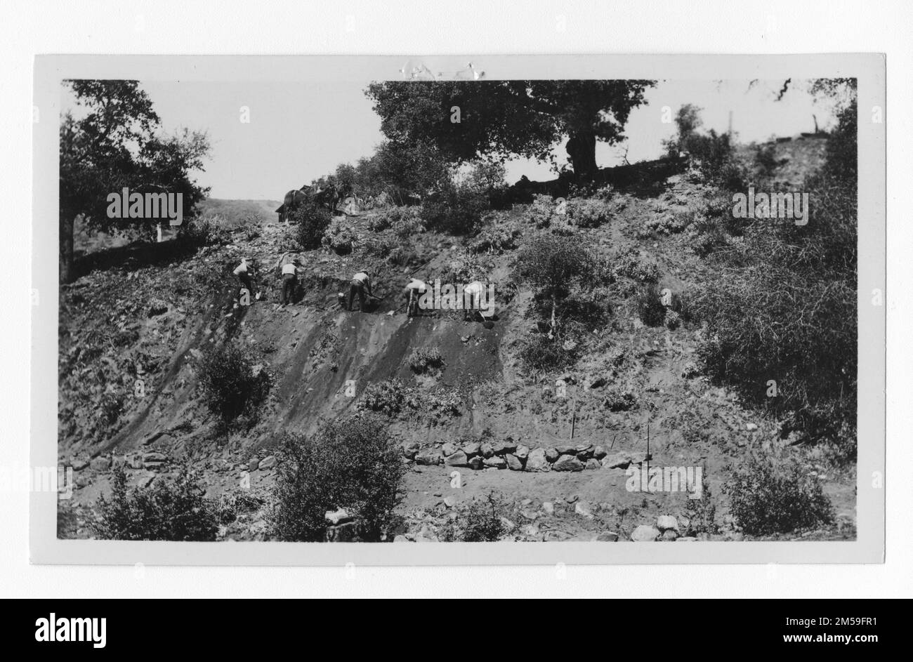 Original caption: "Santa Ysabel. Side hill cut and start of dry masonry ...