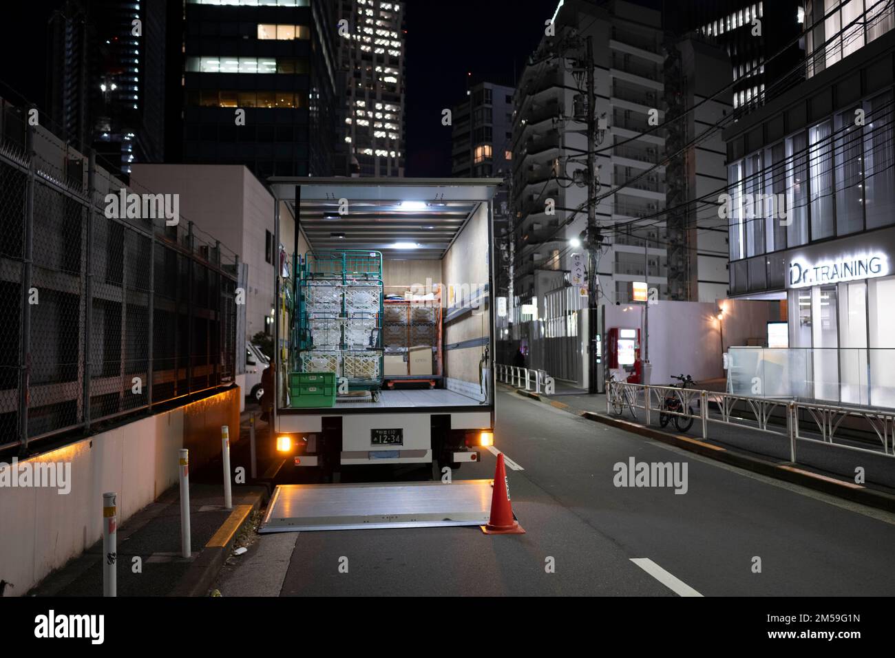 Tokyo, Japan. 26th Dec, 2022. A truck making a delivery loading stop in ...