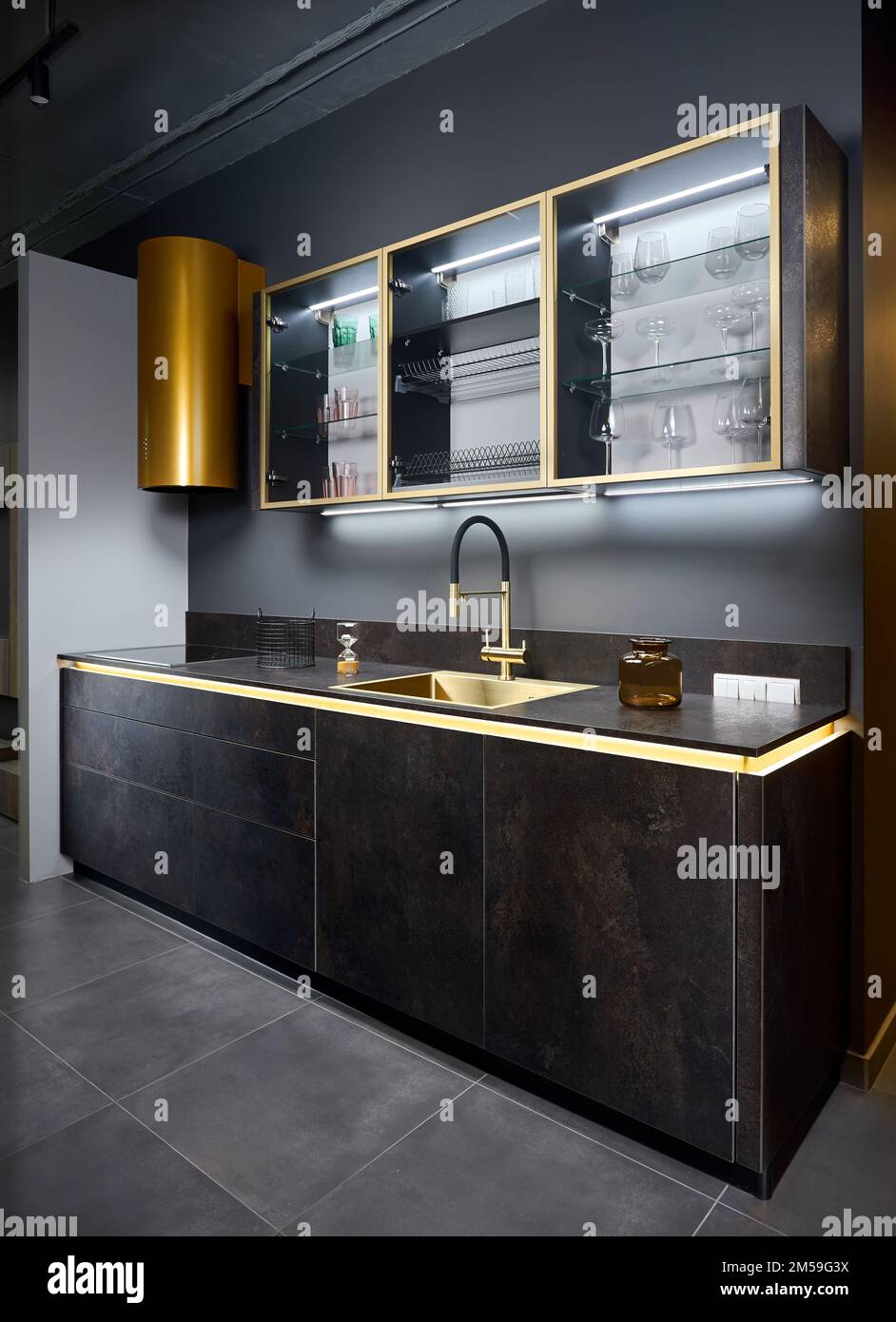 Upscale flat design kitchen with induction black glass hob with ...