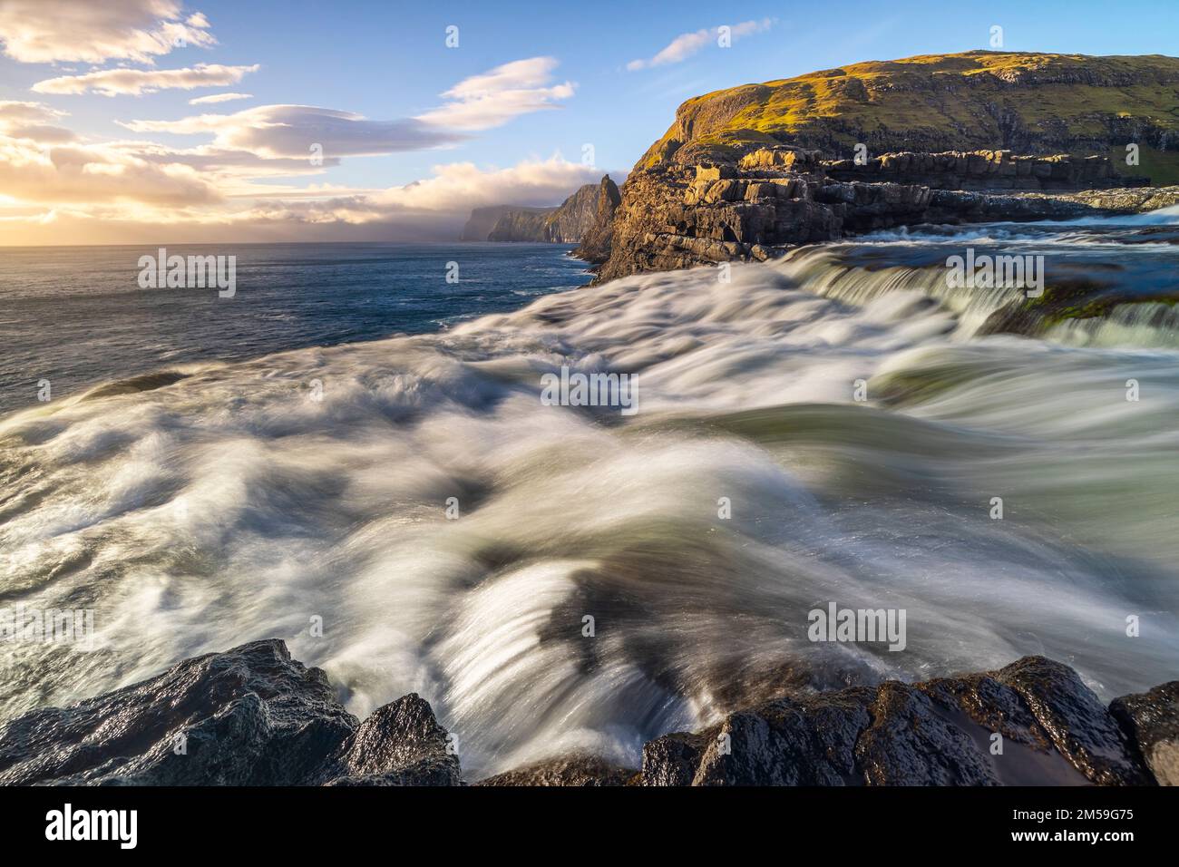Bosdalafossur waterfall at sunset, Sorvagsvatn, Vagar, Faroe Islands ...