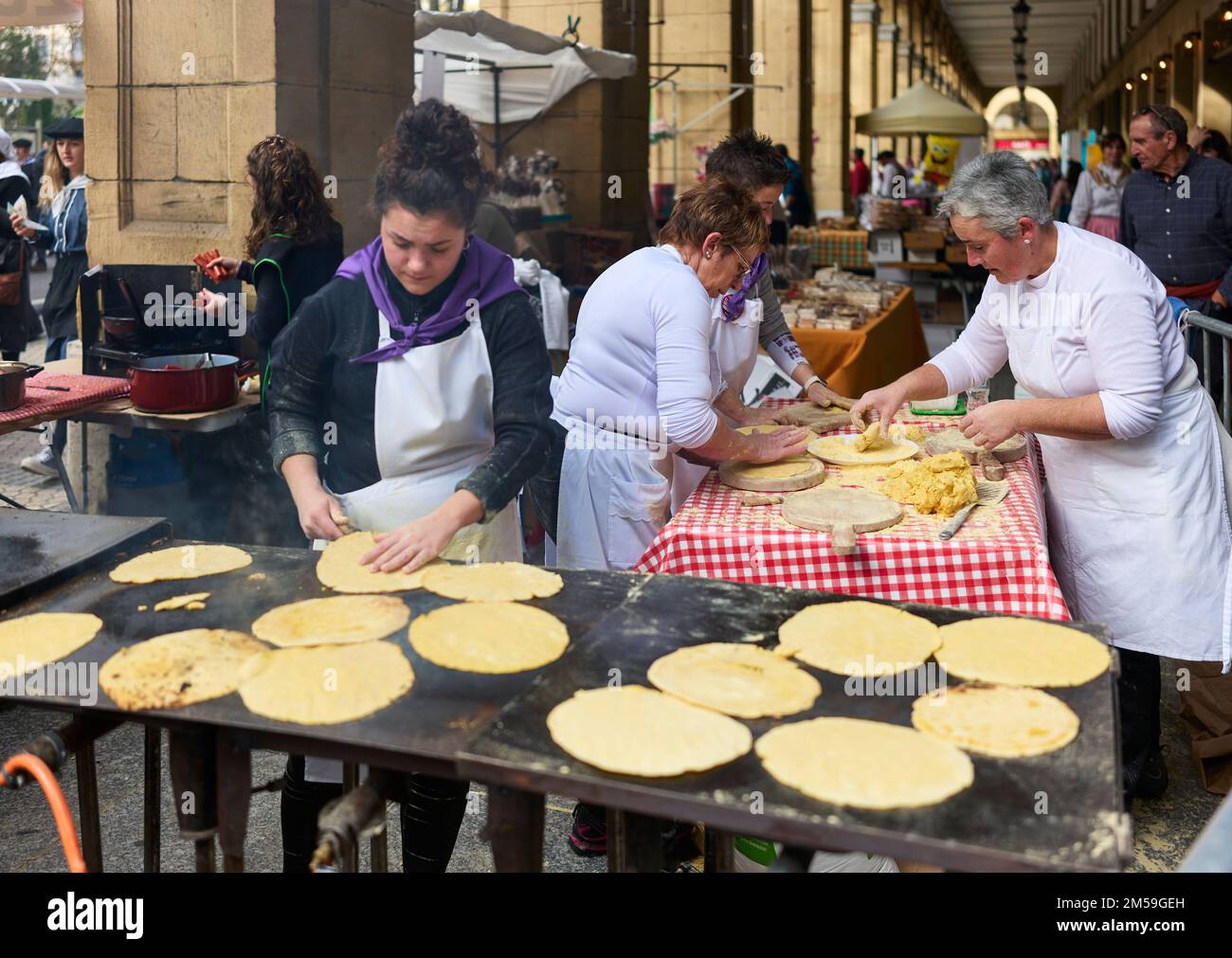 Basque farmers making Talos (basque tortilla) in the Santo Tomas Fair ...