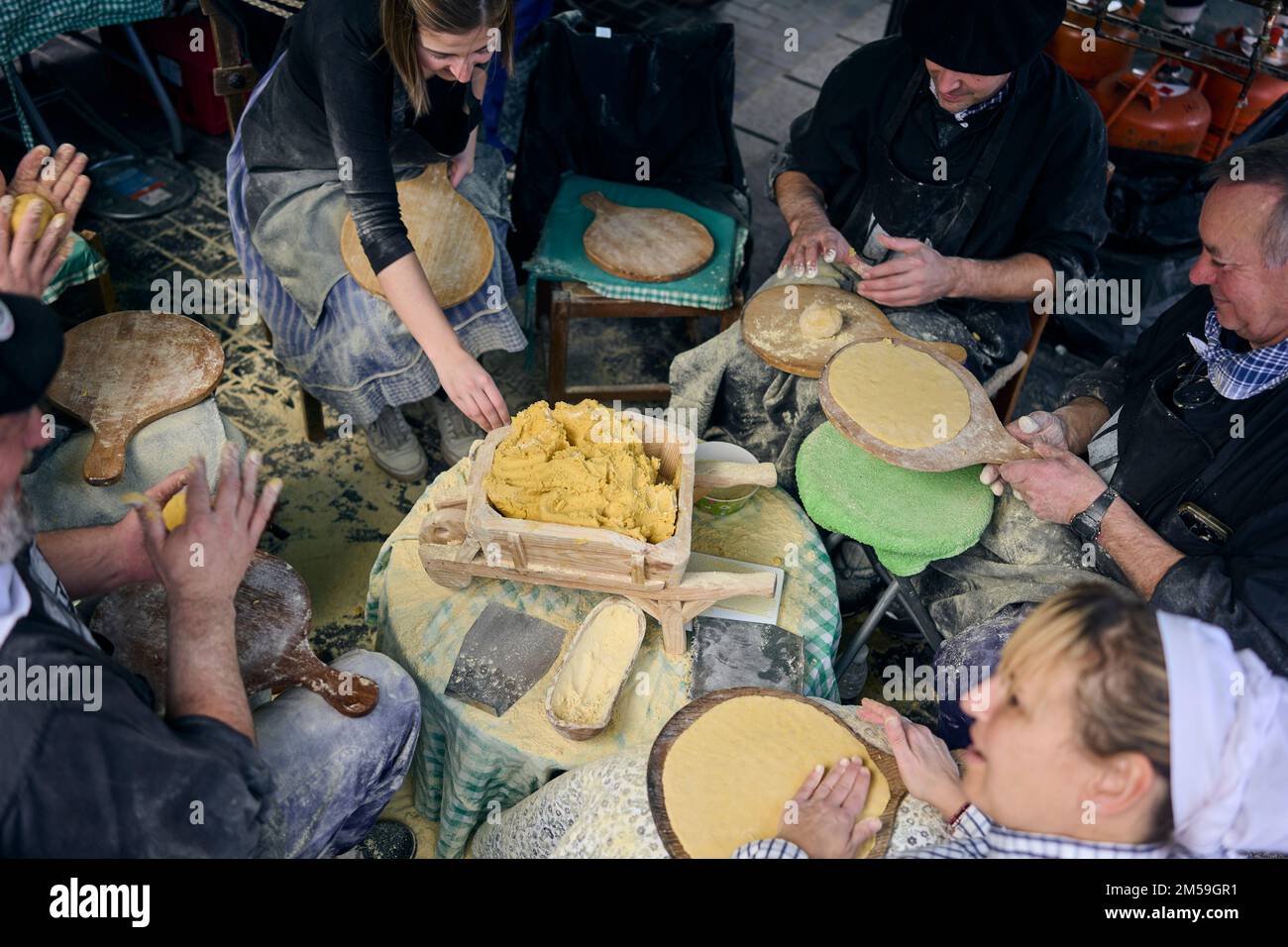 Basque farmers making Talos (basque tortilla) in the Santo Tomas Fair ...