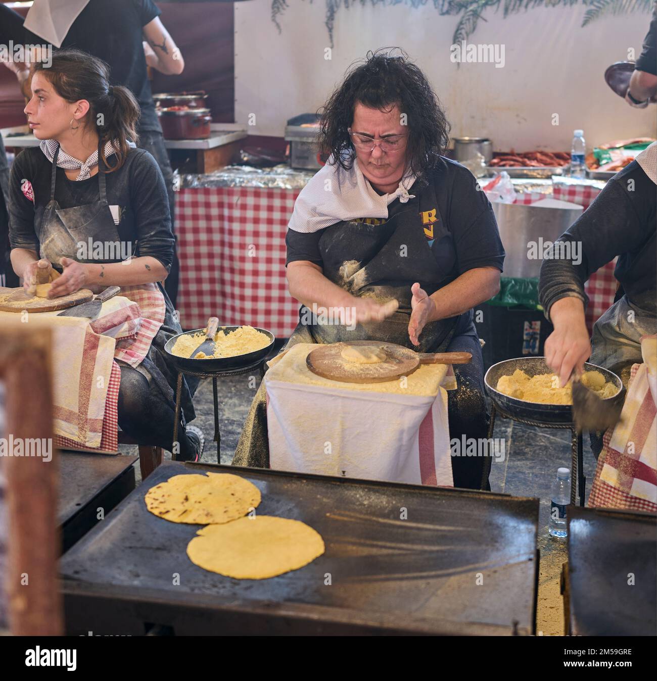 Basque farmers making Talos (basque tortilla) in the Santo Tomas Fair ...