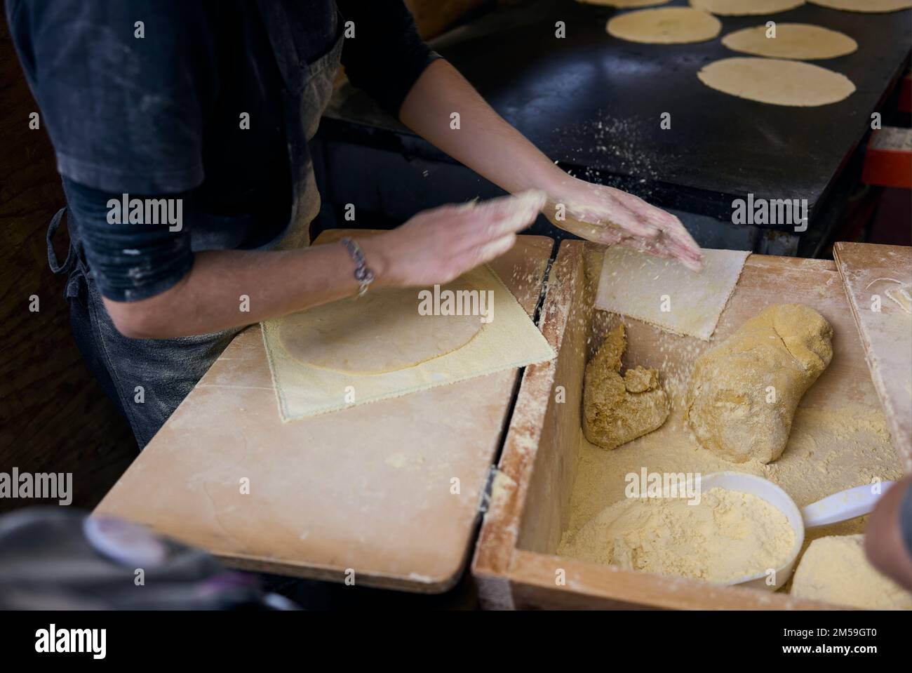 Basque farmers making Talos (basque tortilla) in the Santo Tomas Fair ...