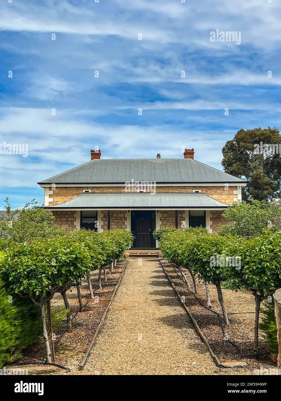 A beautiful view of a pathway leading to the house Stock Photo - Alamy