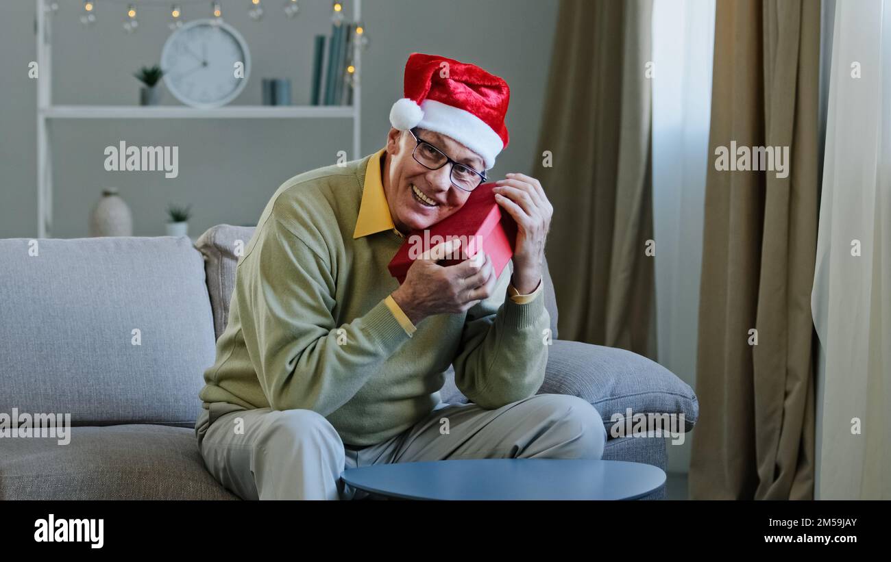 Father christmas with parcel hi-res stock photography and images - Alamy