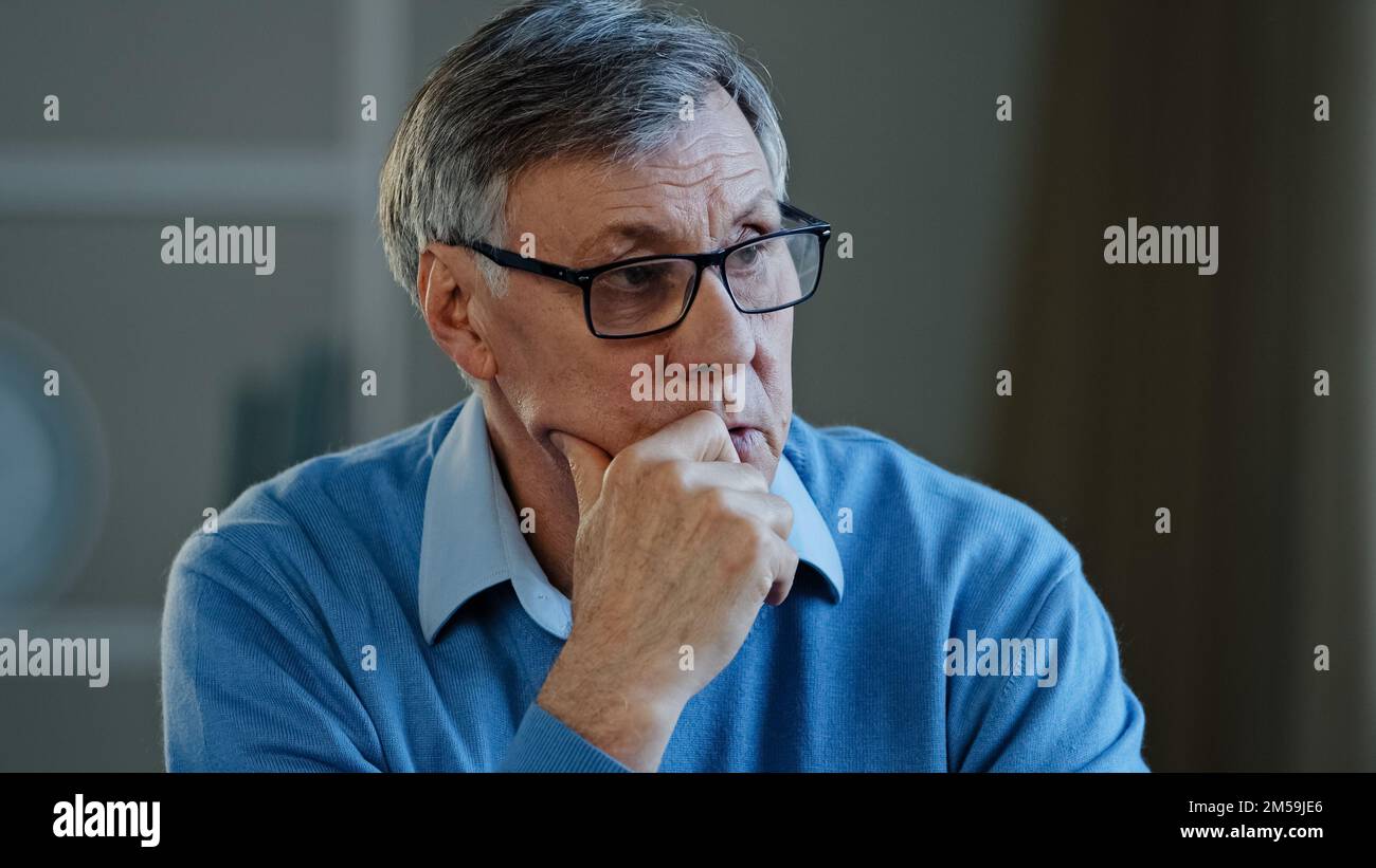 Portrait indoor in office home old thoughtful pensive confused senior ...