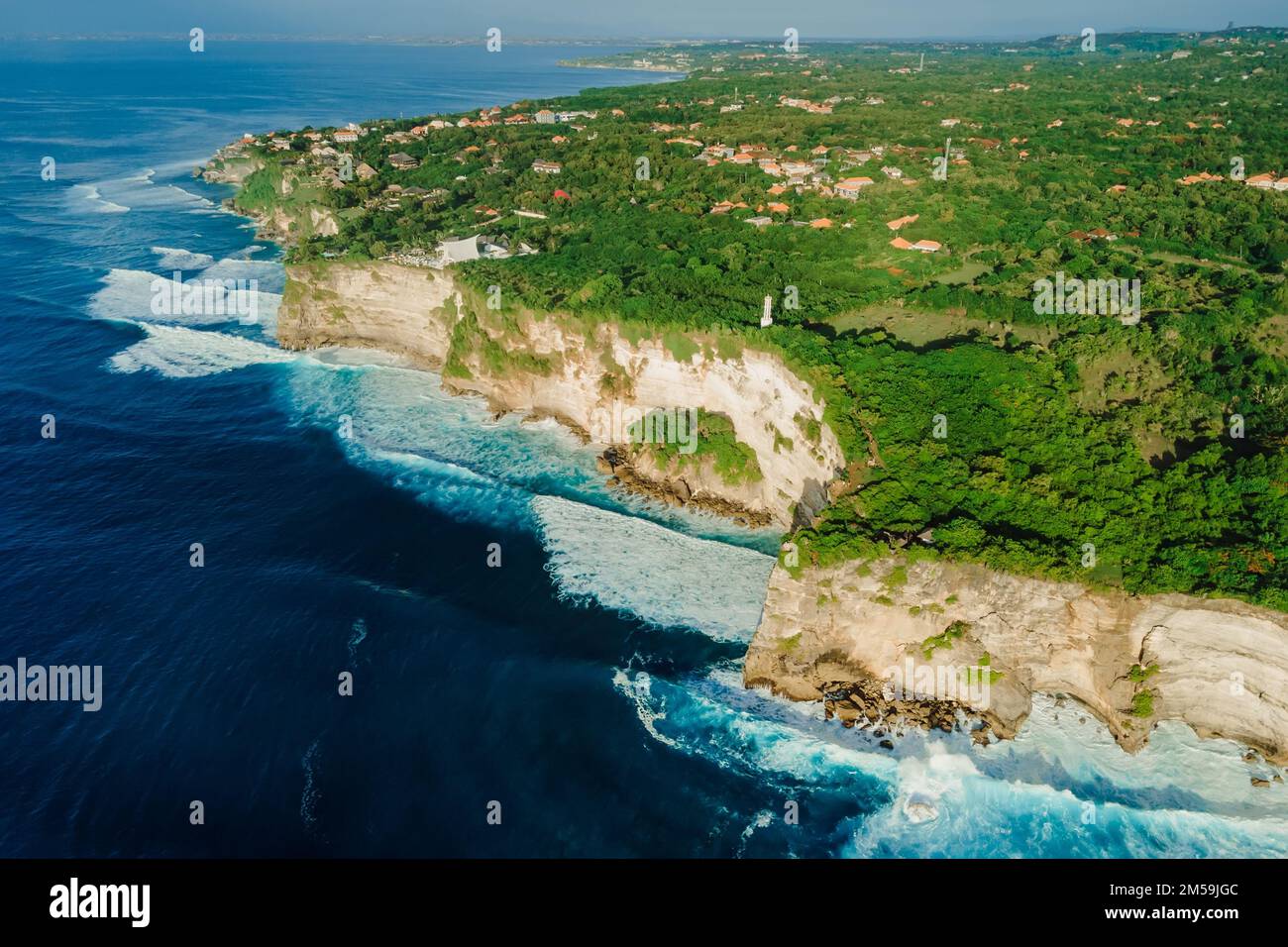 Aerial view of scenic coastline with cliffs, ocean with waves and ...