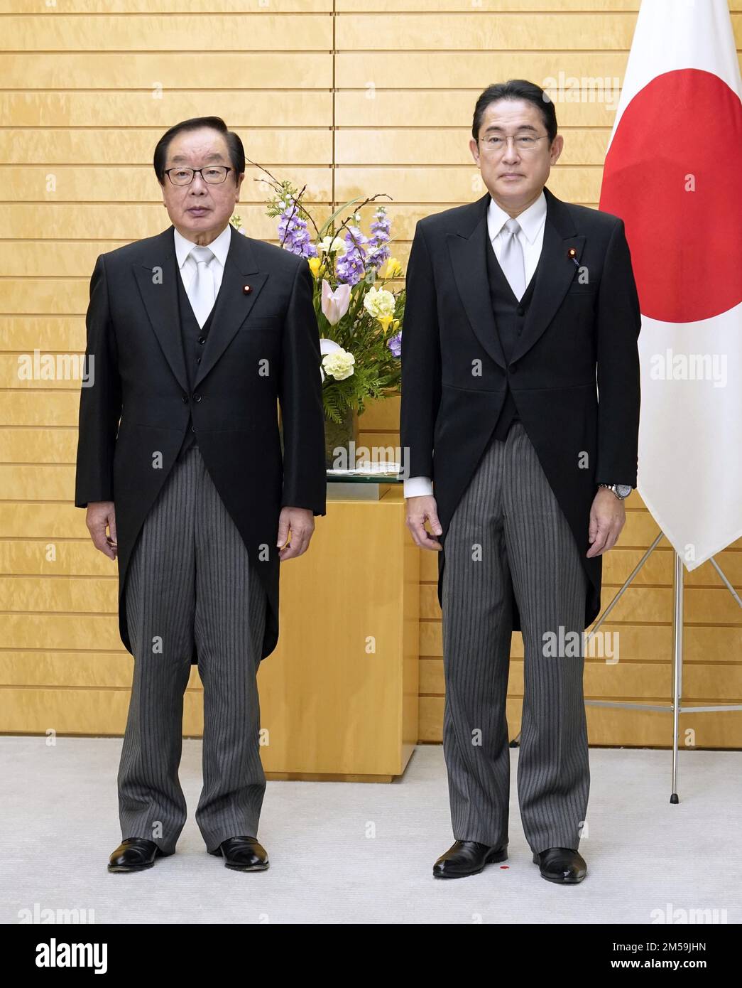 New Japanese reconstruction minister Hiromichi Watanabe (L) and Prime ...