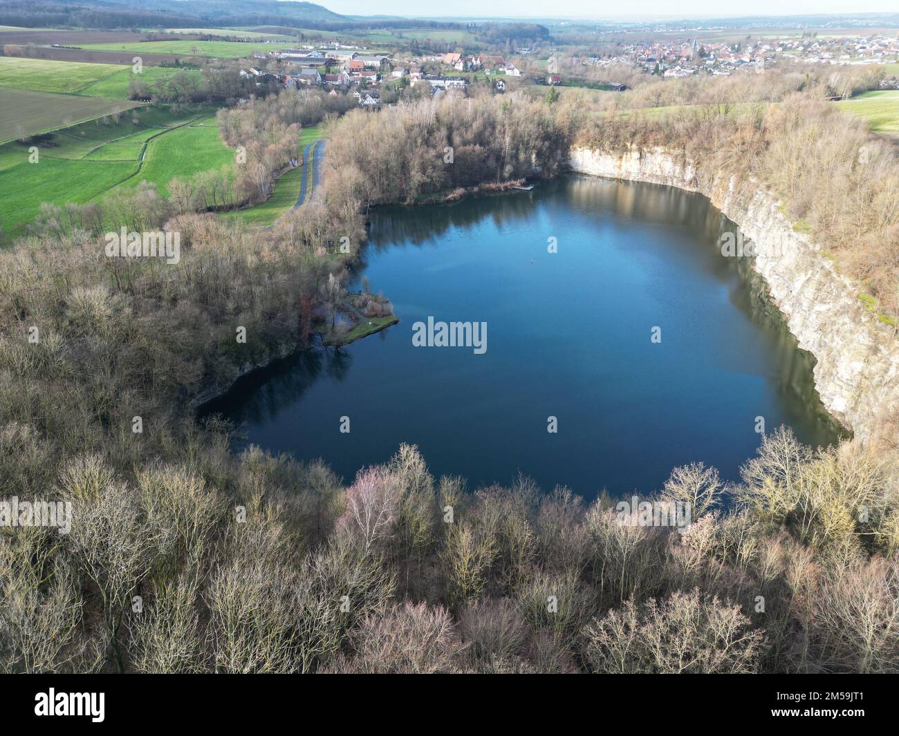 An aerial view of a small lake surrounded by trees Stock Photo - Alamy