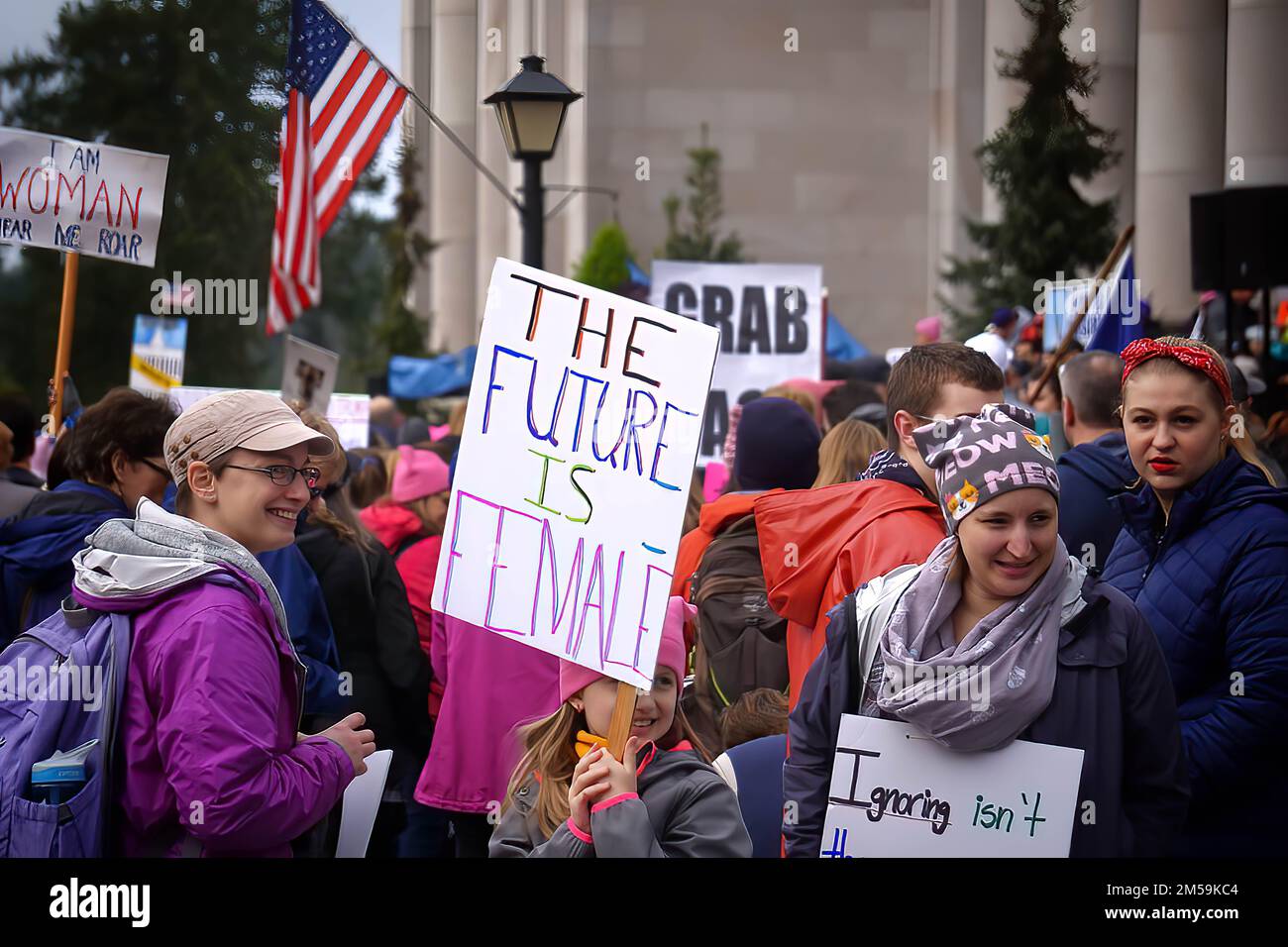 Many women holding signs in protest at the 3rd Annual Woman's March at ...