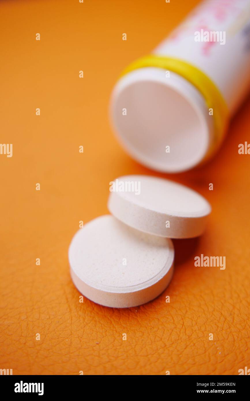 Effervescent soluble tablet pills on orange purple background Stock ...