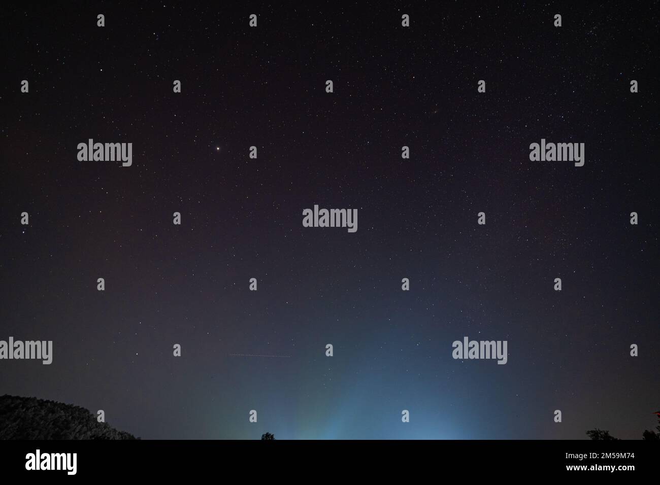A scenic shot of a starry sky at night and a piece of land perfect as a ...