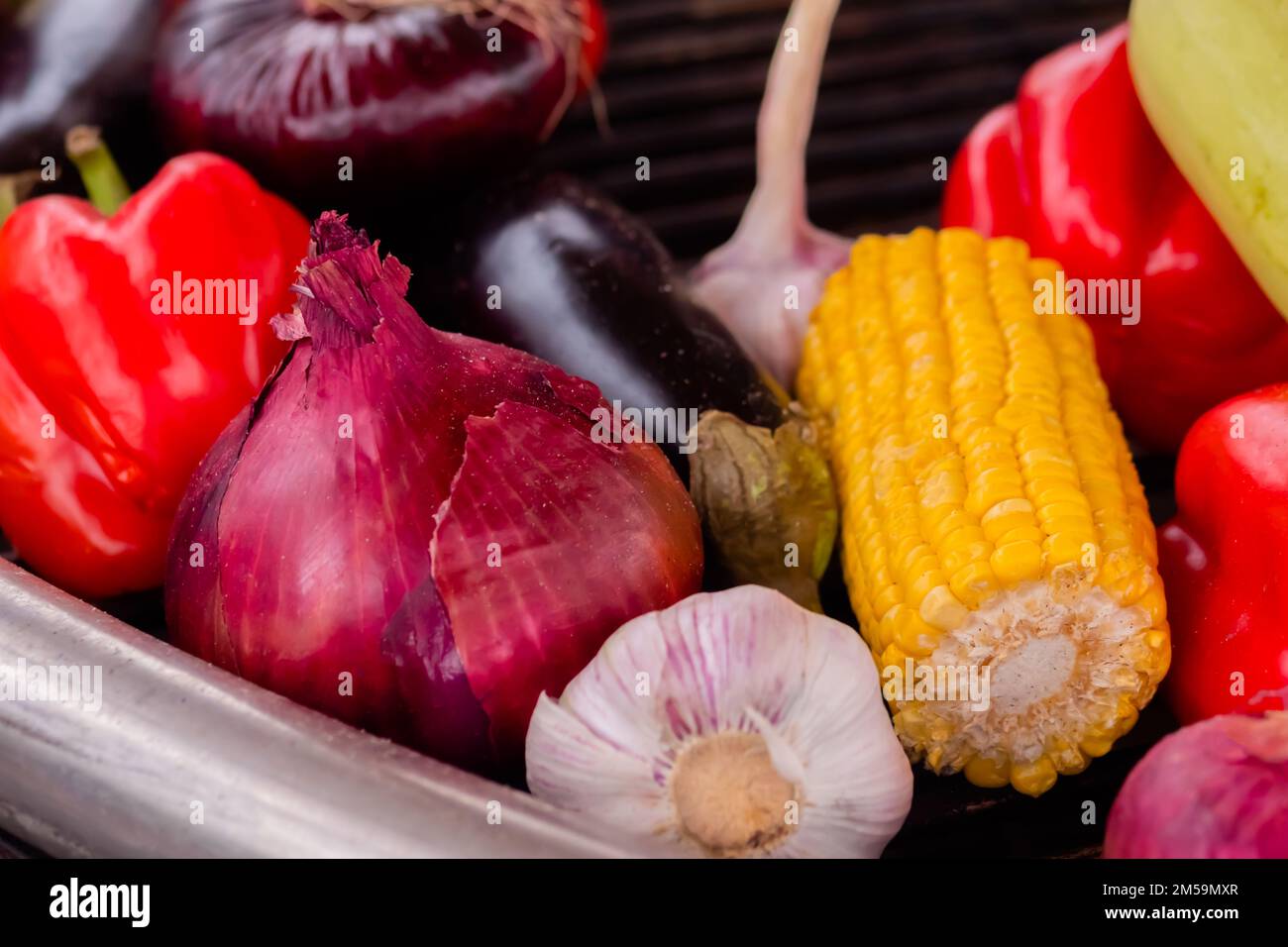 Process of grilling healthy vegetables - pepper, corn, zucchini, onion ...