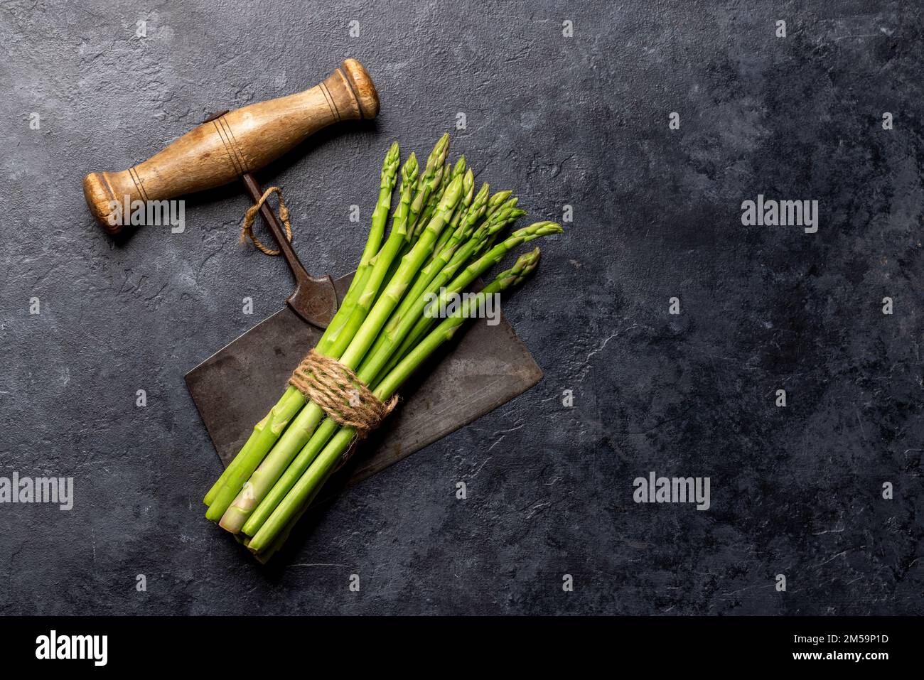 Bunch of fresh asparagus on stone table. Flat lay with copy space Stock ...