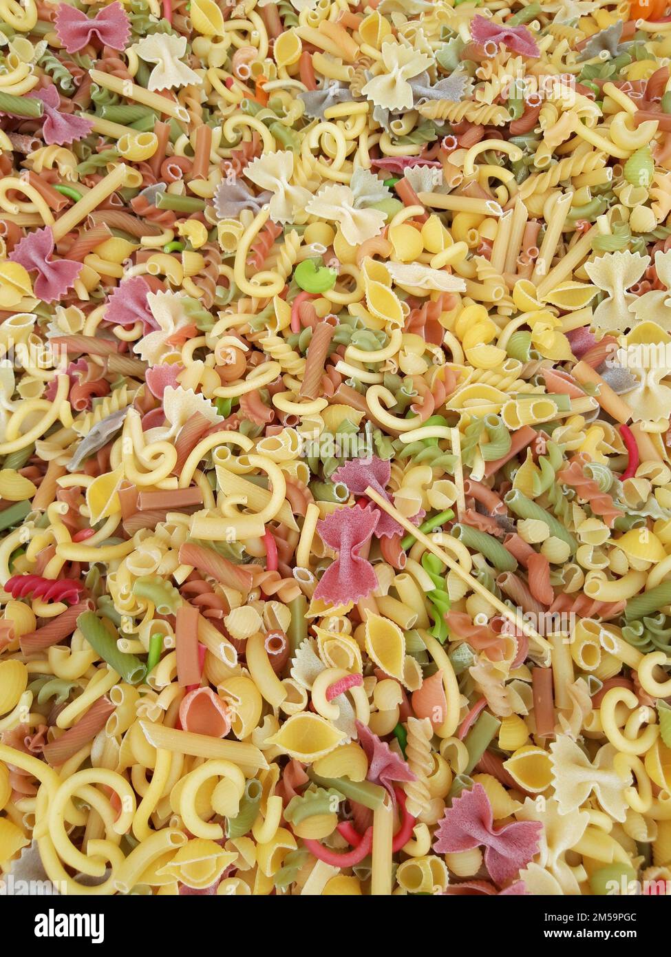 A pile of colorful different types of macaroni Stock Photo - Alamy