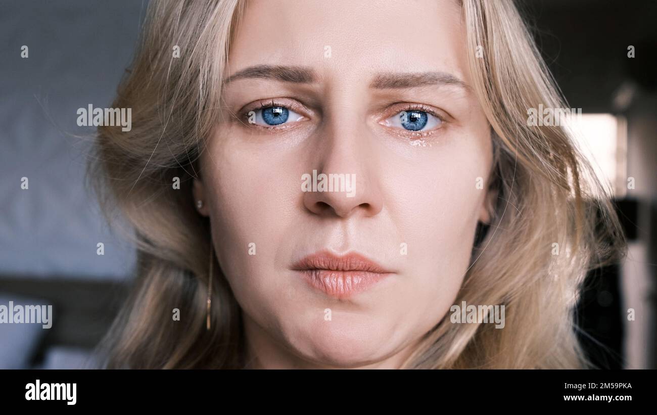 Portrait of crying grieving woman of 30 years. Grimace of sadness with ...