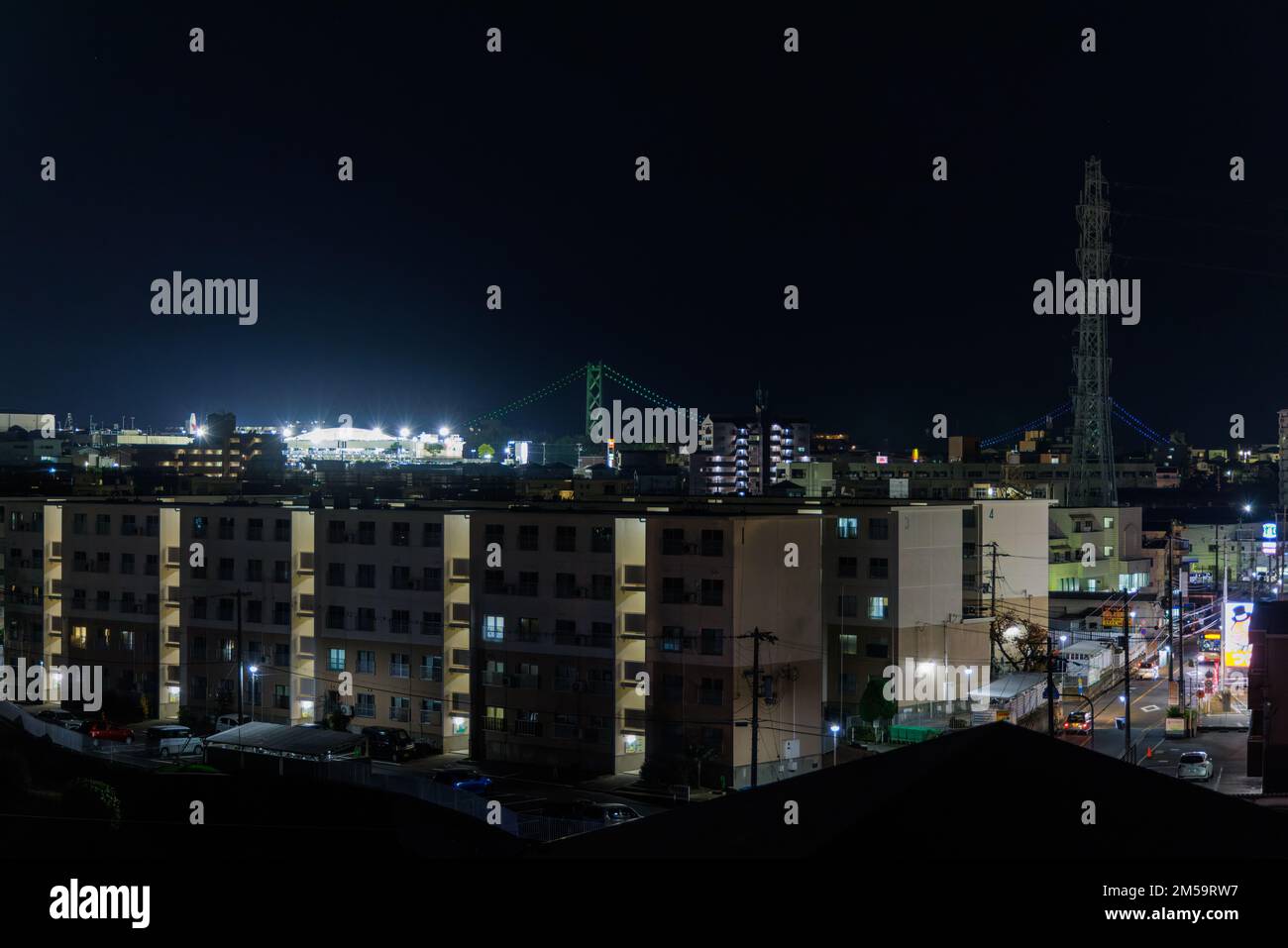 Low rise apartment buildings in small city at night Stock Photo - Alamy