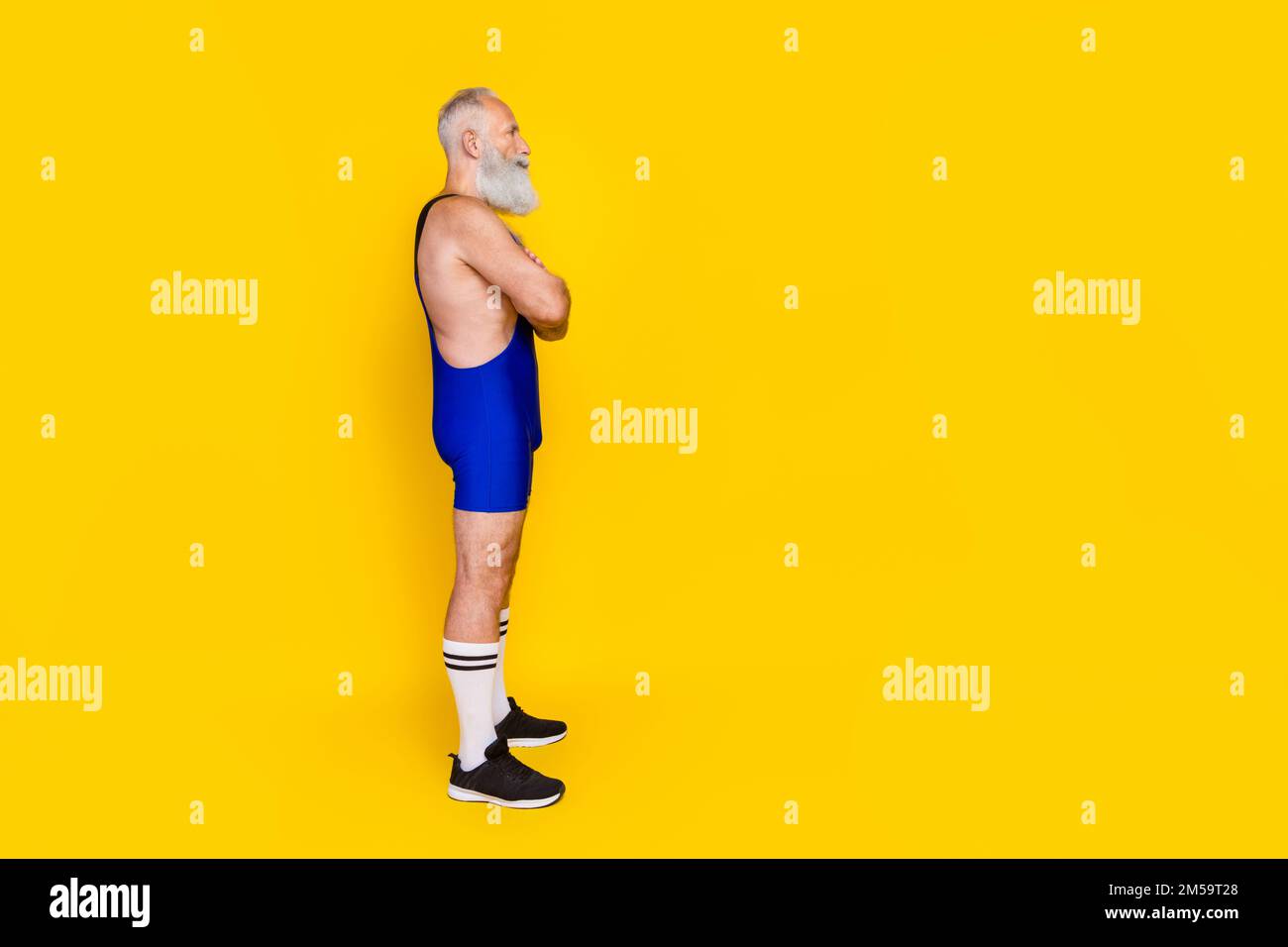 Side profile full length body photo of old professional bodybuilder ...