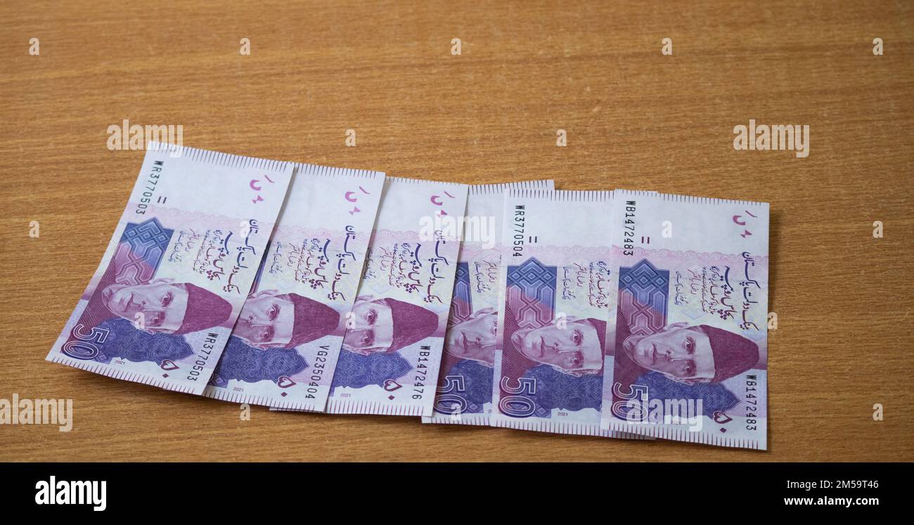 Pakistani 50 Note Isolated on wood background, 50 rupees banknotes ...