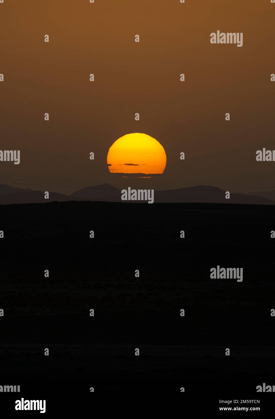 Sun at sunset, Merzouga desert Stock Photo - Alamy
