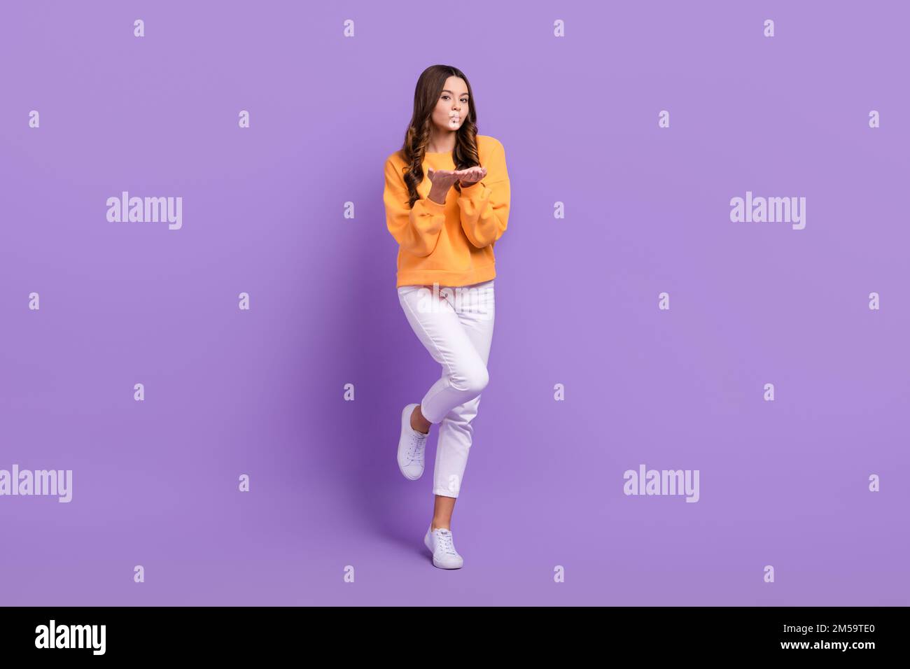 Full length photo of adorable cute lady wear orange sweatshirt sending ...