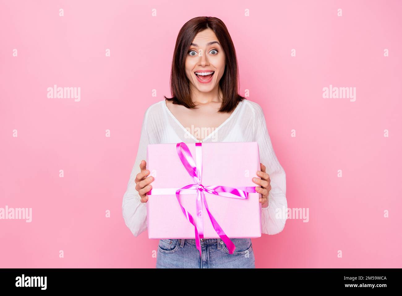 Photo of overjoyed lady dressed stylish clothes hand hold box impressed ...
