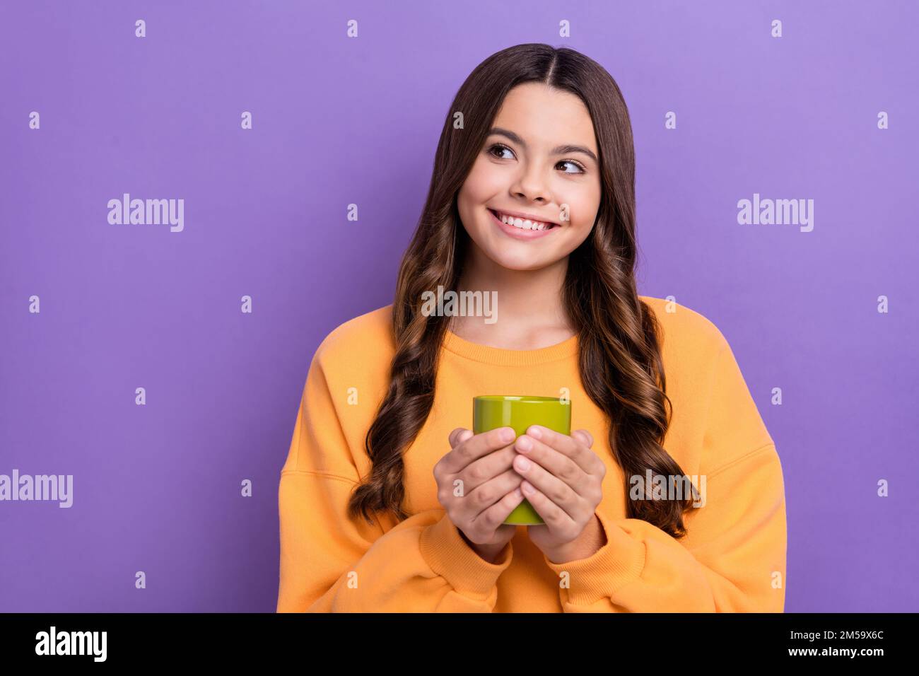 Photo of adorable dreamy lady wear orange sweatshirt enjoying beverage ...