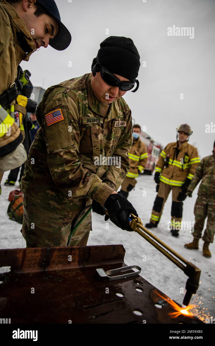 FC392-0003: A firefighter with the Anchorage Fire Department utilizes a ...