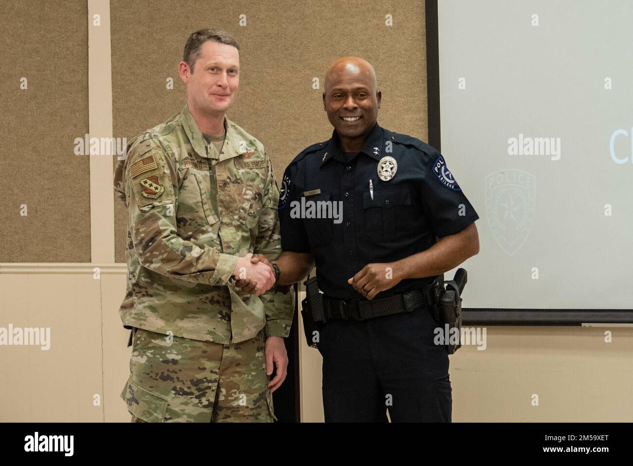 Col. Joseph Kramer, 7th Bomb Wing commander, left, shakes hands with ...